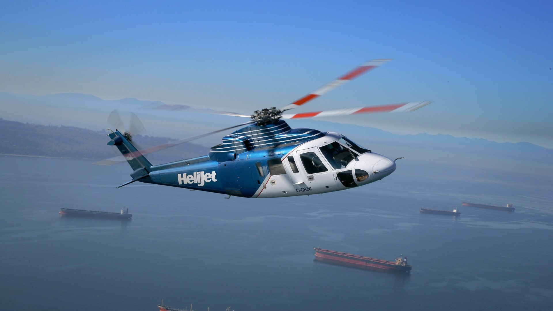 HD Helicopter Aerial View: Sleek Vehicle Soaring Above the Sea ...