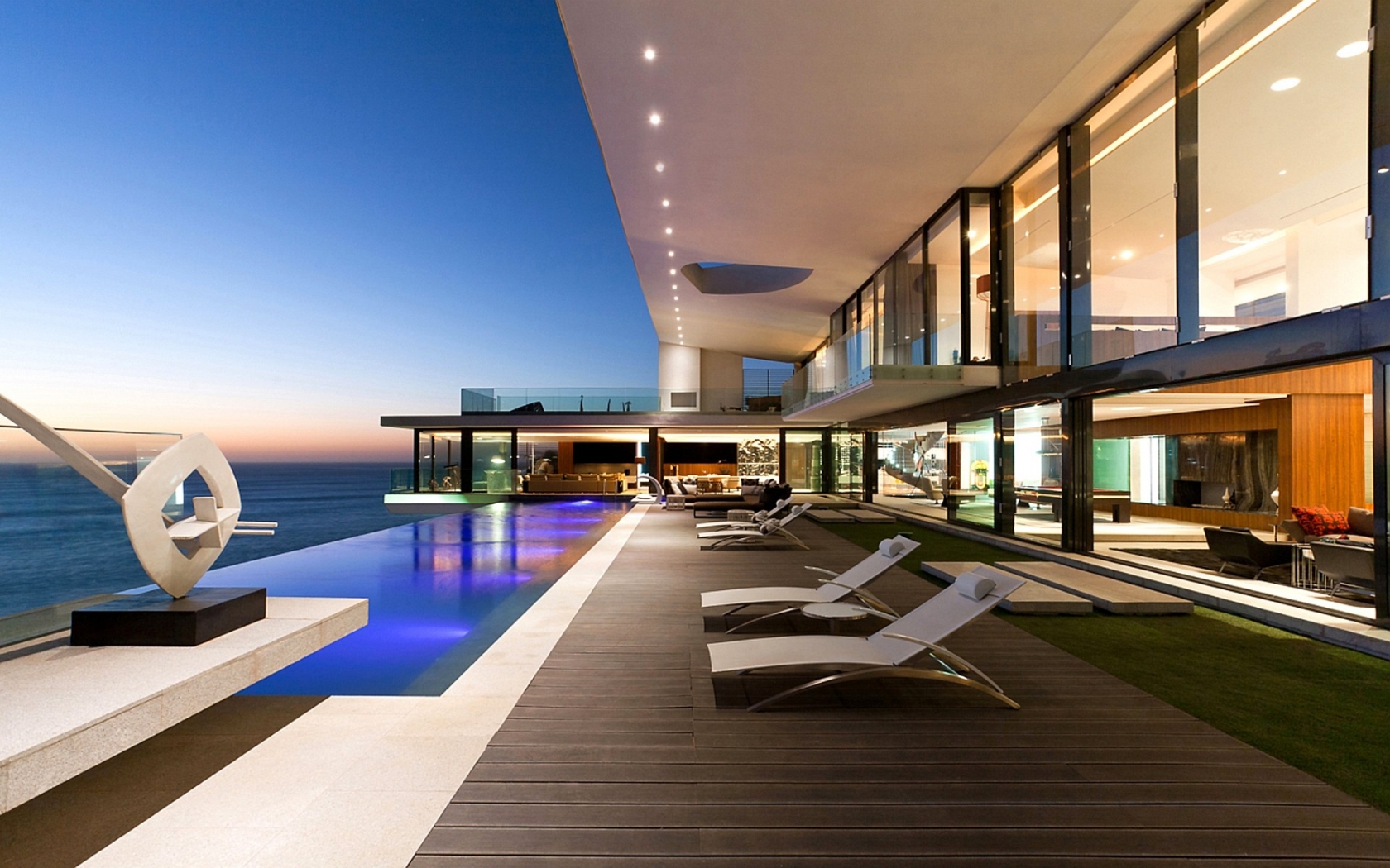 Modern Masterpiece: Stunning Man-Made House with Infinity Pool HD Wallpaper
