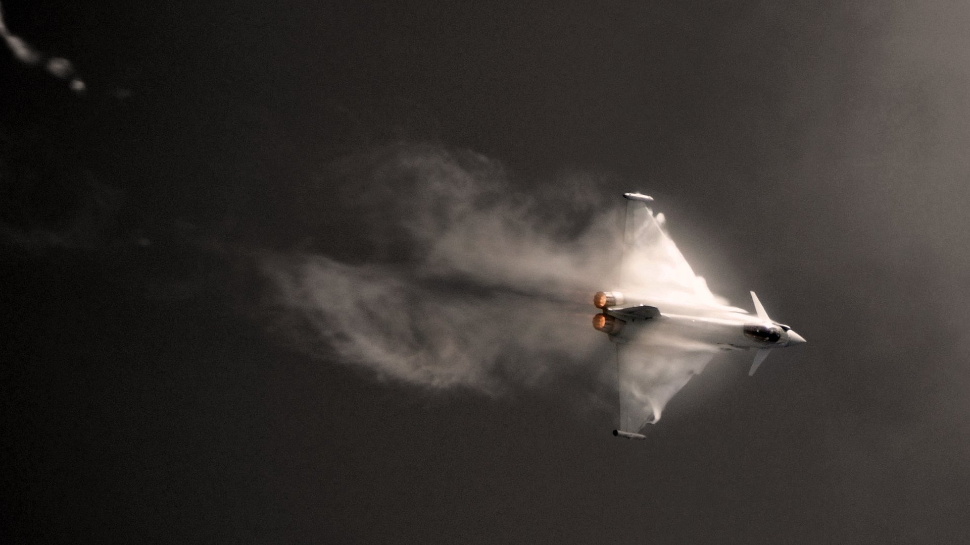 Strike Wings: HD Wallpaper of a Jet Fighter in Action