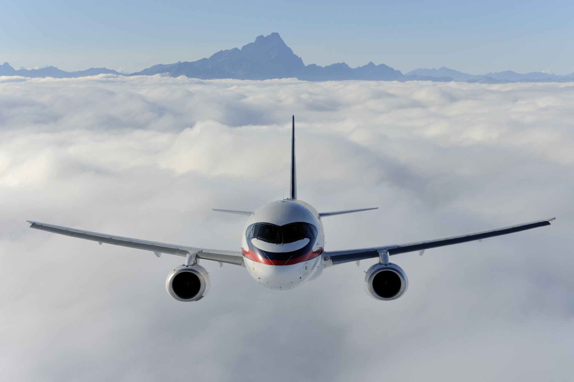 Sukhoi SuperJet 100 Soaring Above Clouds | 4K Ultra HD Jet Wallpaper