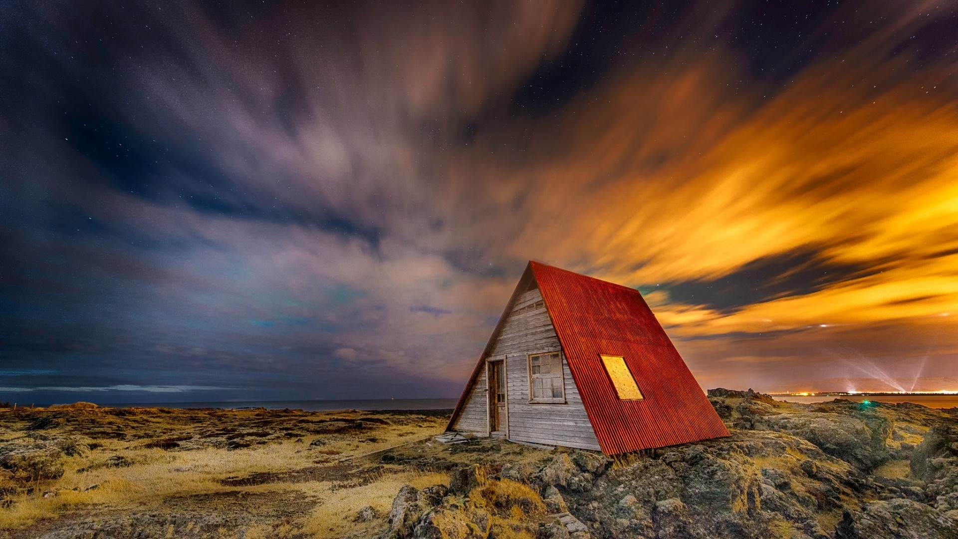 Stunning Icelandic Sky: AHD Wallpaper of a Triangular House