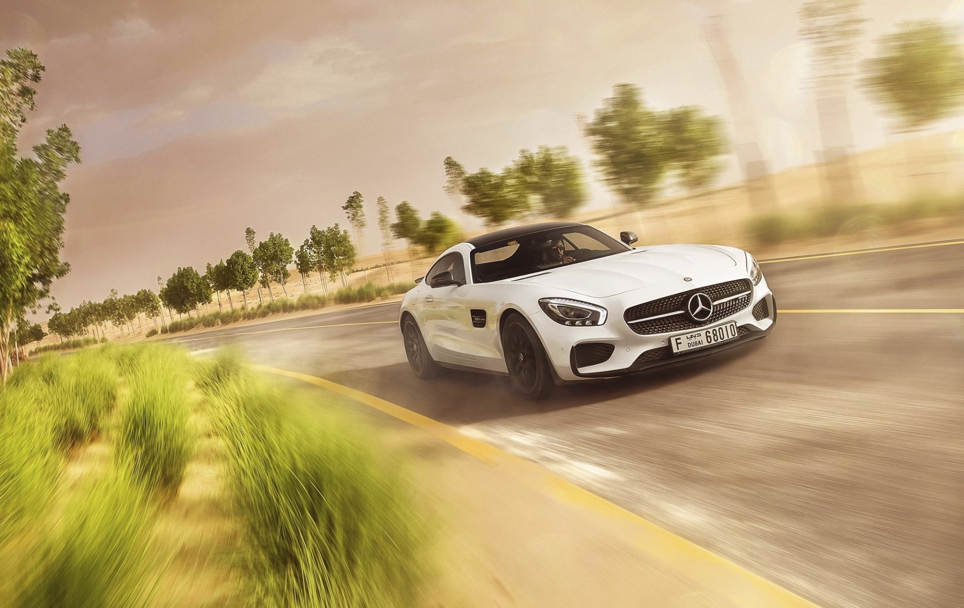 Speed and Elegance: White Mercedes-AMG GT in Motion Blur HD Wallpaper