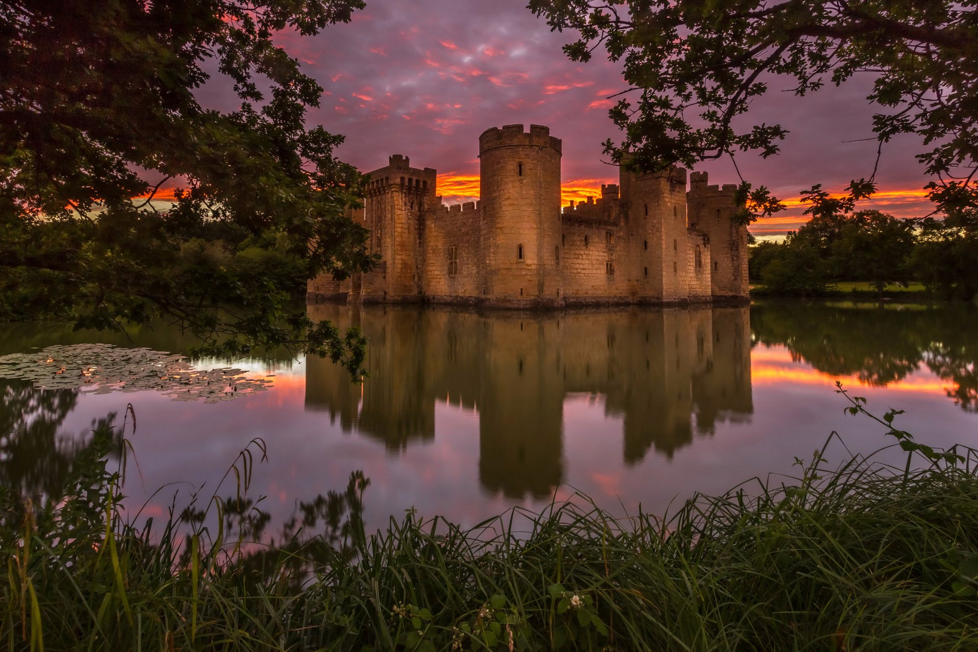 Majestic Castle Reflection at Sunset Over Serene Pond | HD Wallpaper