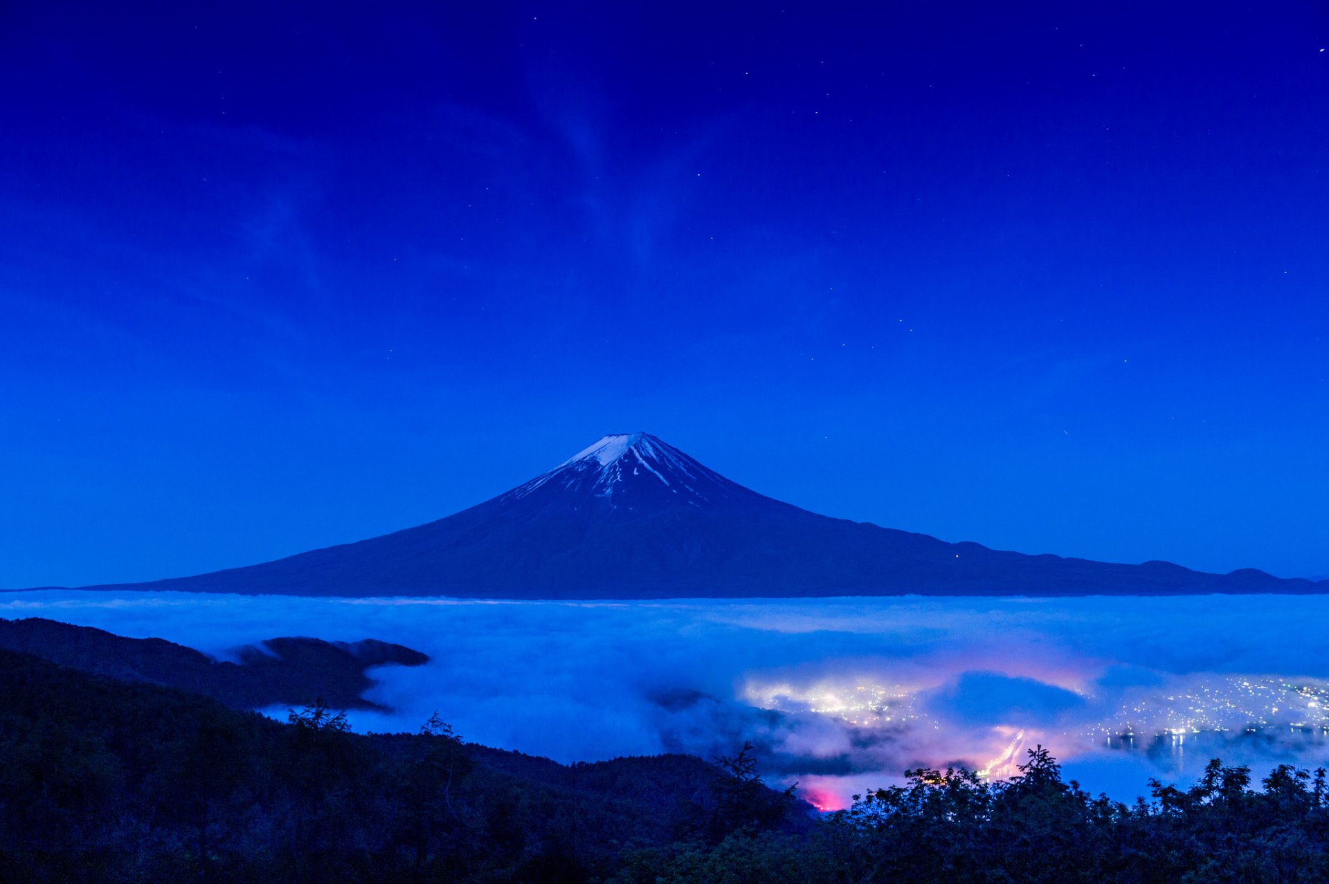 Mount Fuji Mystique: Night Fog Embraces Japan’s Majestic Volcano Landscape